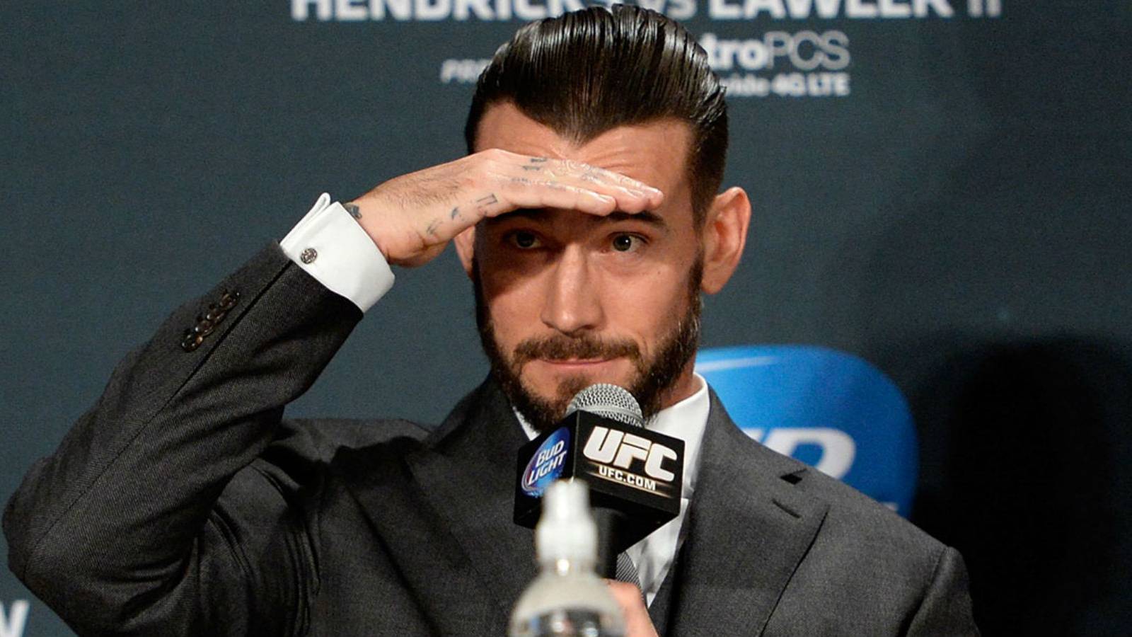 CM Punk Falls Off Chair At UFC Event [VIDEO]