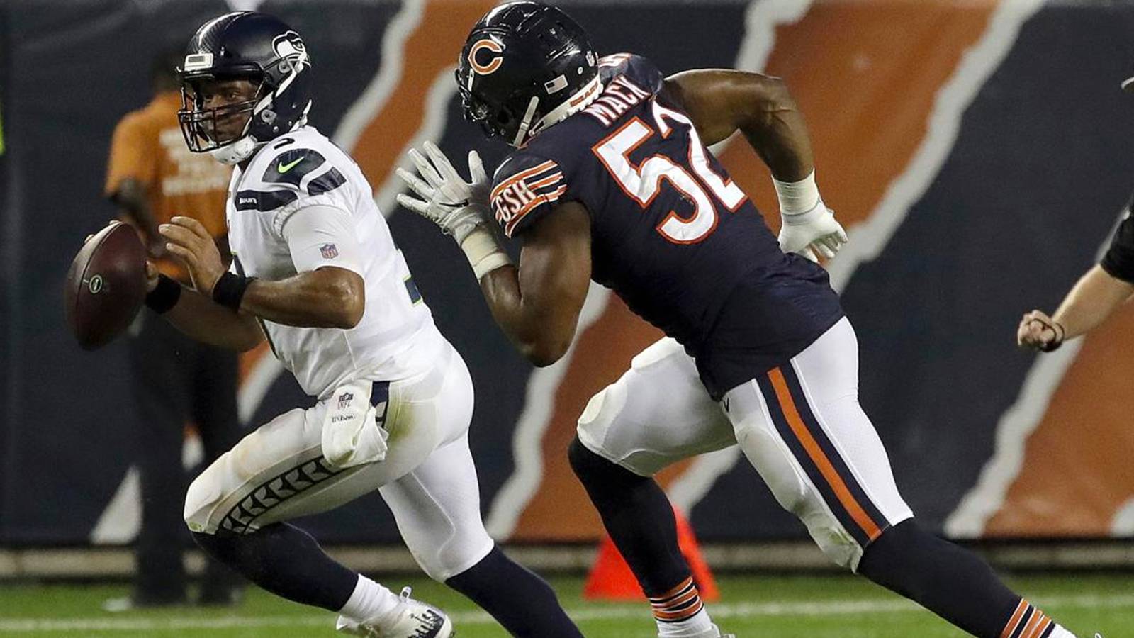 Russel Wilson Signs His Own Jersey For Khalil Mack [Video]